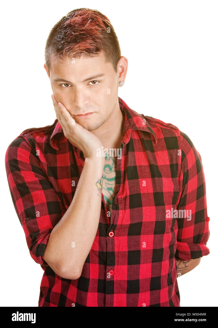 Serious man with spiky orange hair and hand on chin Stock Photo - Alamy