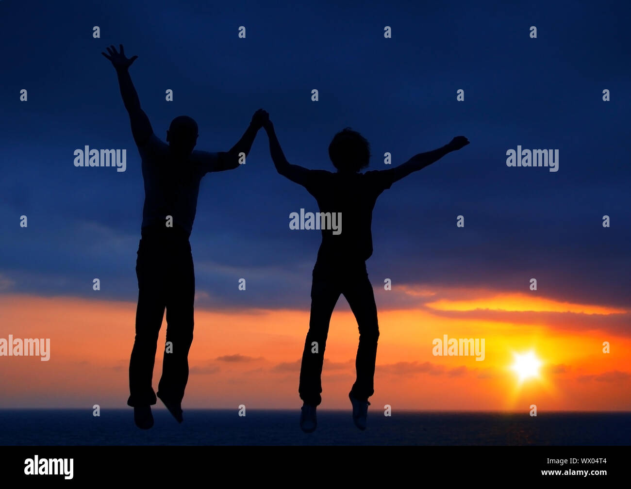 Two happy jumpers Stock Photo - Alamy