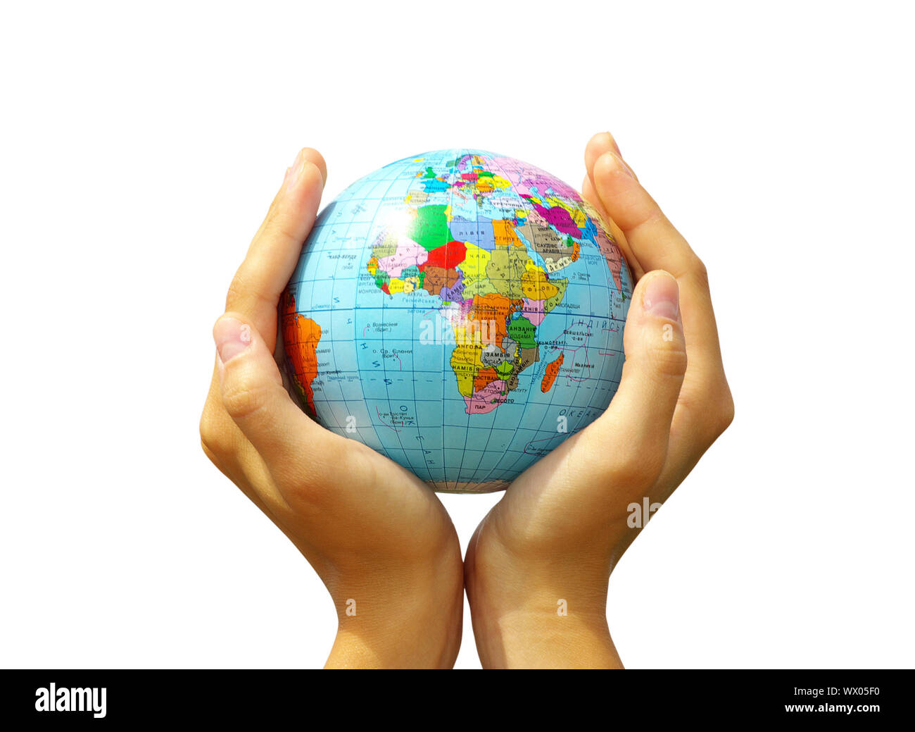 Hand holdings a globe on a white Stock Photo - Alamy