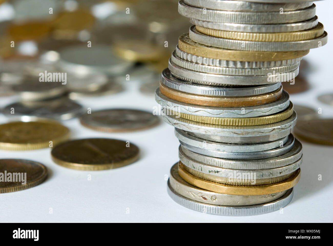 Coin pile isolated on white background Stock Photo - Alamy