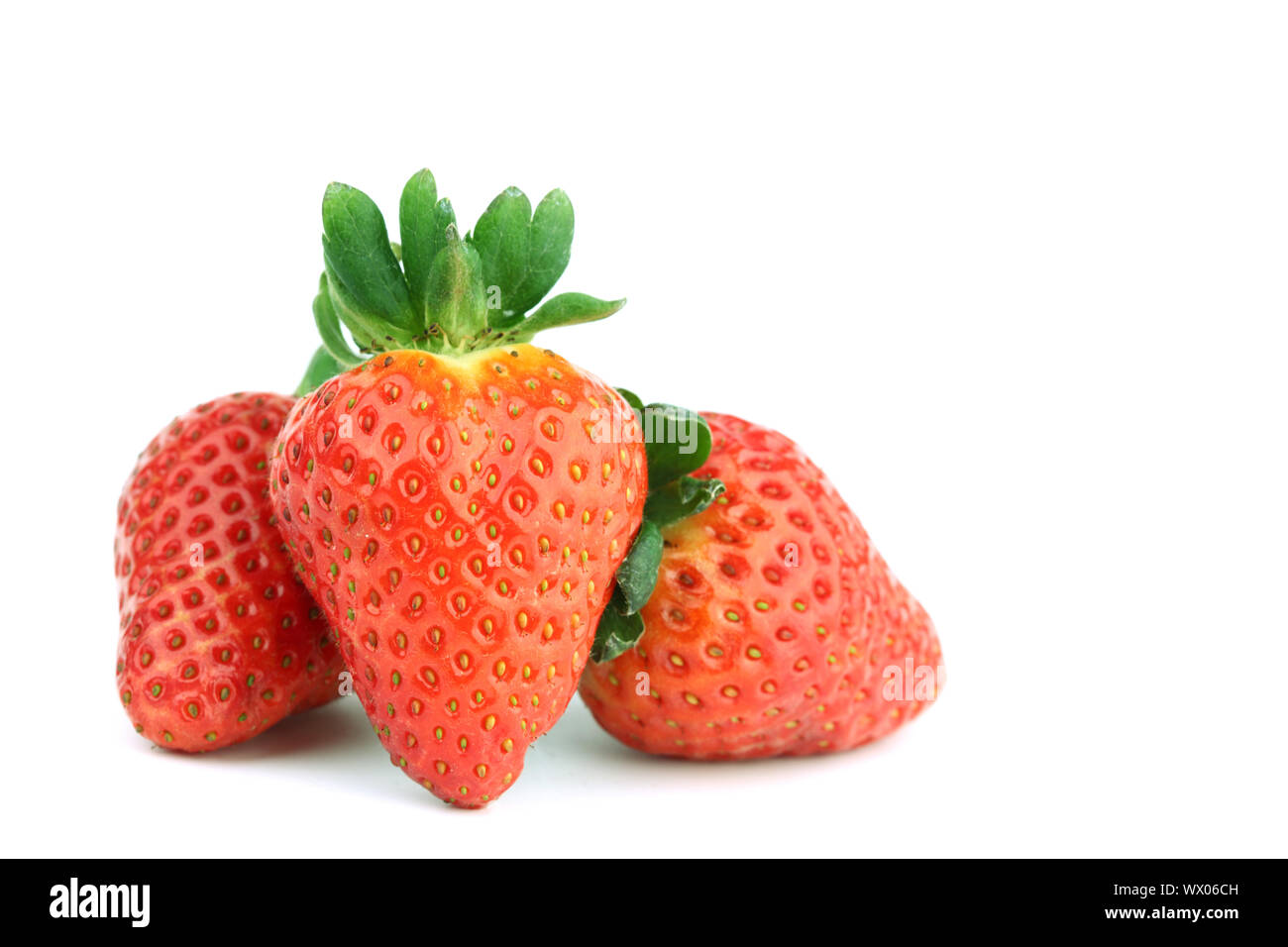 strawberry pile on white background Stock Photo - Alamy