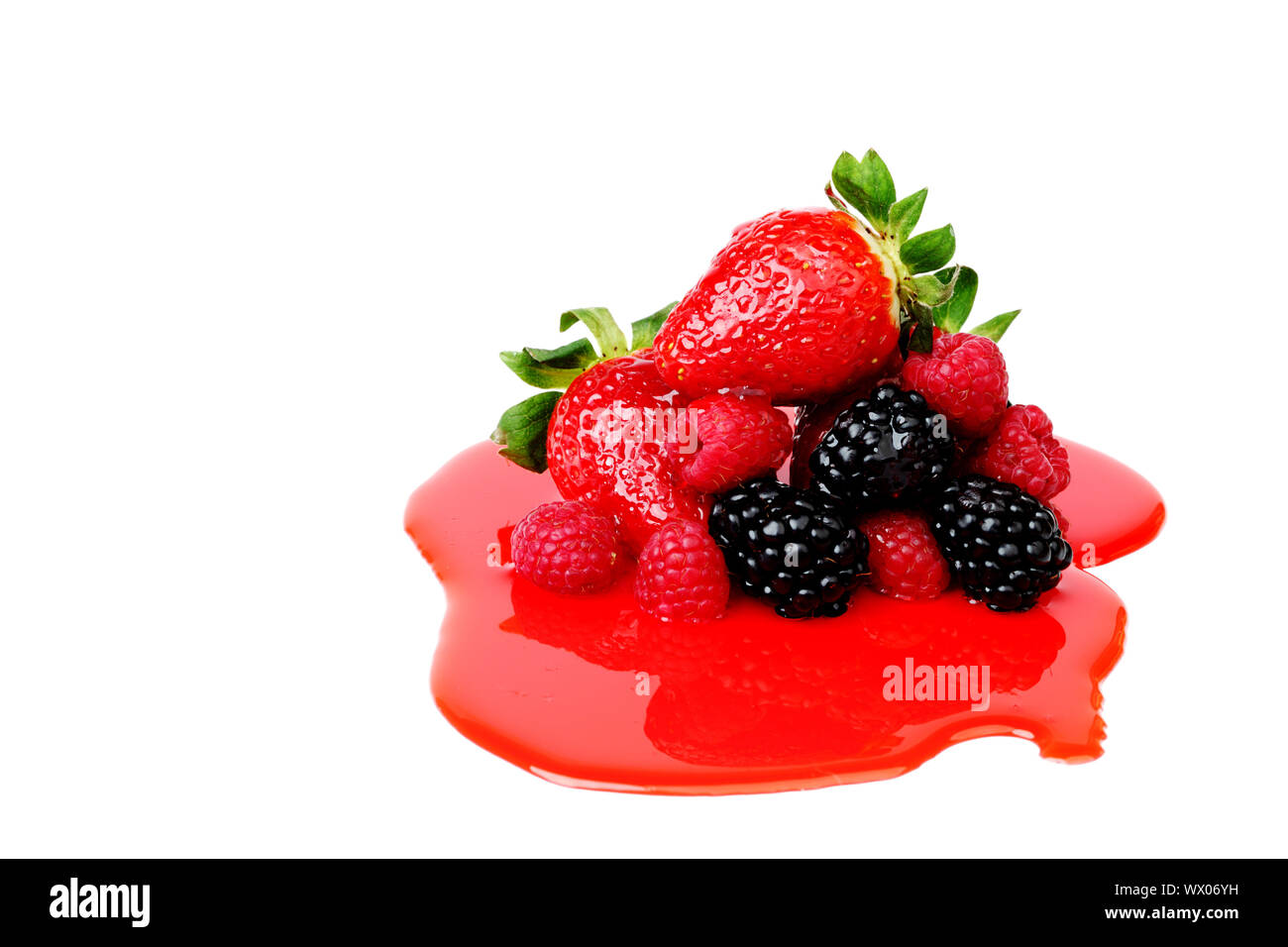 big berry pile in syrup isolated on white Stock Photo - Alamy