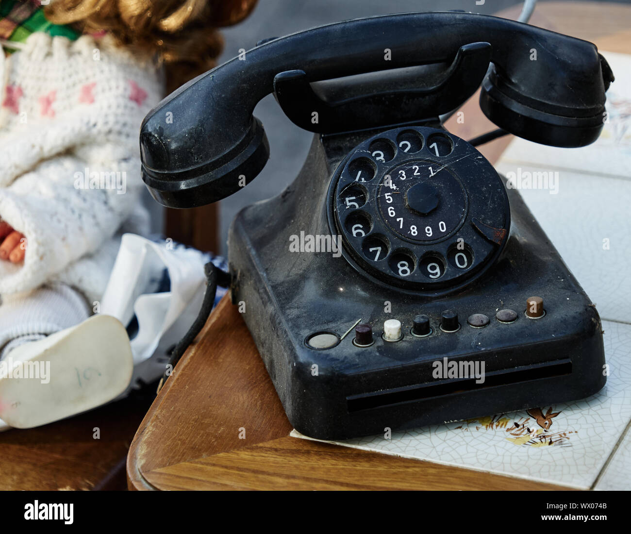 Old dirty dusty analog black phone with mechanical dial Stock Photo - Alamy