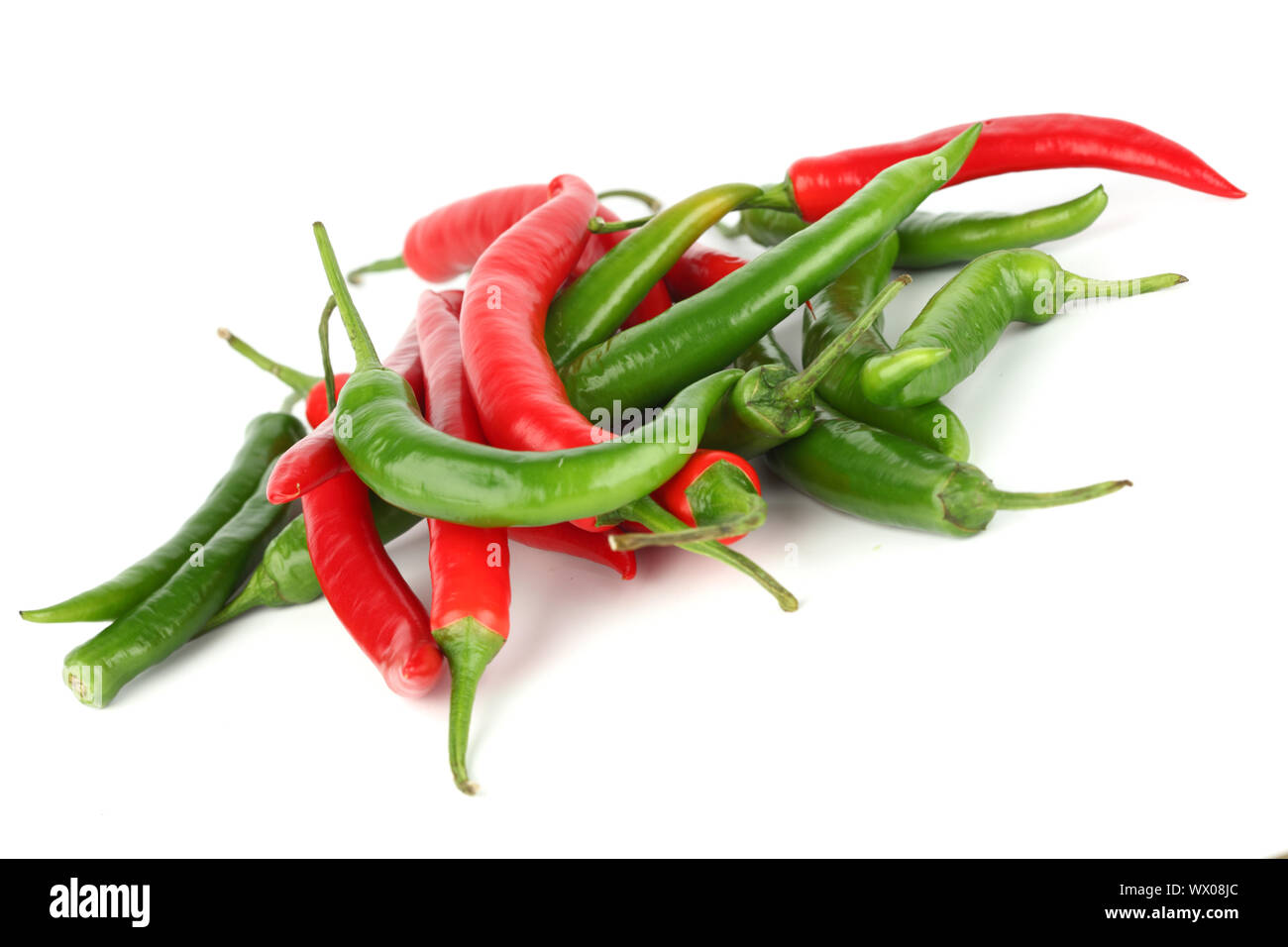mixed chilli pile isolated on white Stock Photo - Alamy
