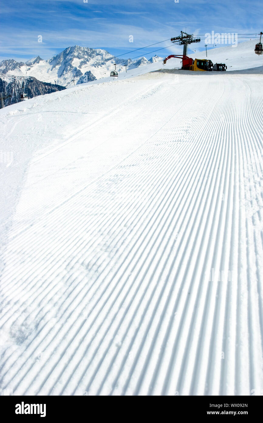 Snowcat track close-up with Snowcat at background Stock Photo - Alamy