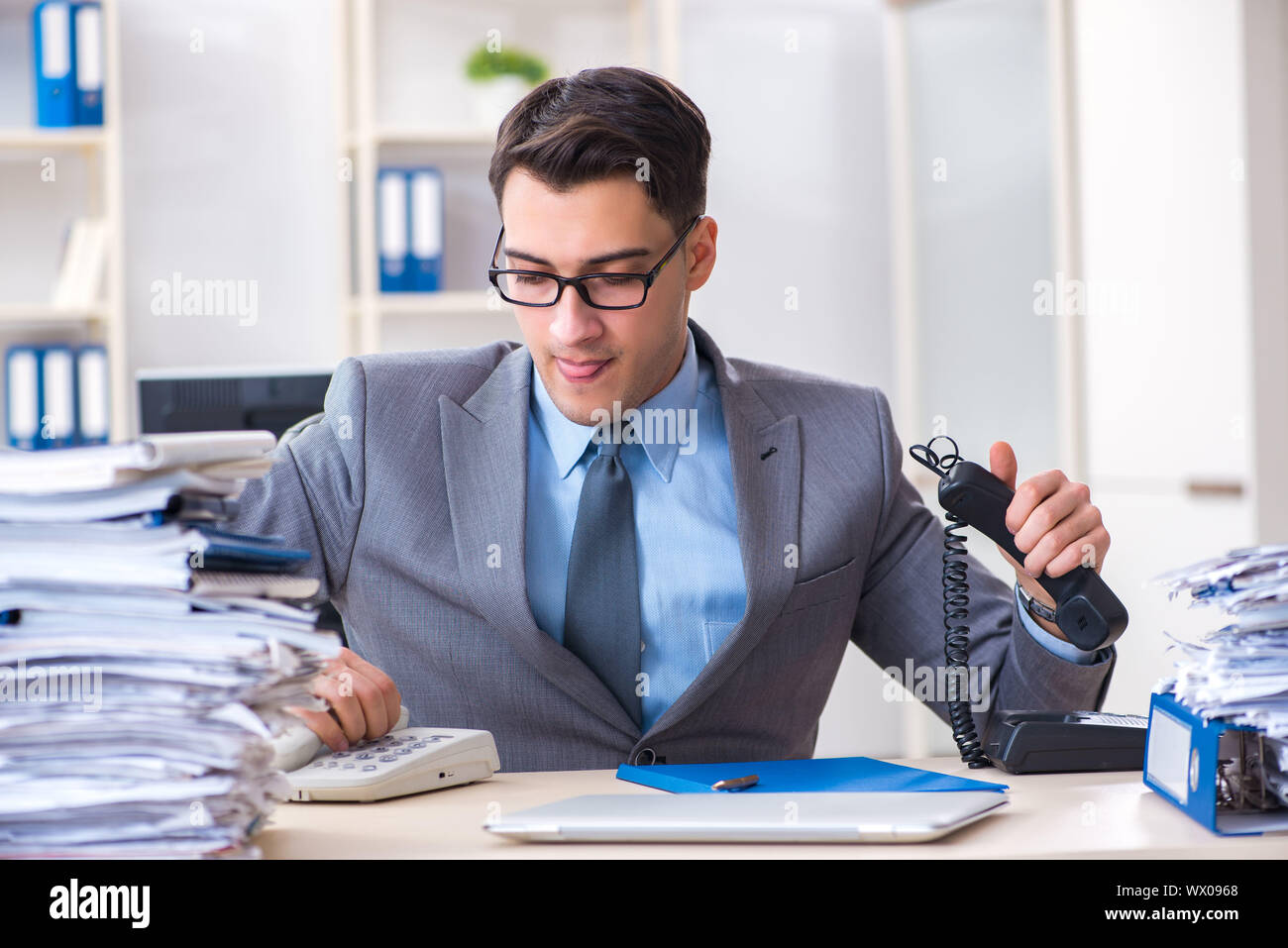 Desperate sad employee tired at his desk in call center Stock Photo - Alamy