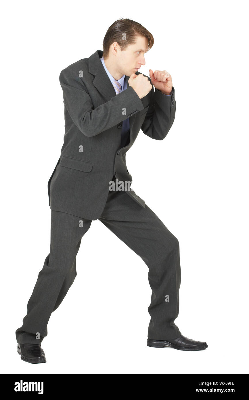 A man in a combat stance, isolated on a white background Stock Photo ...