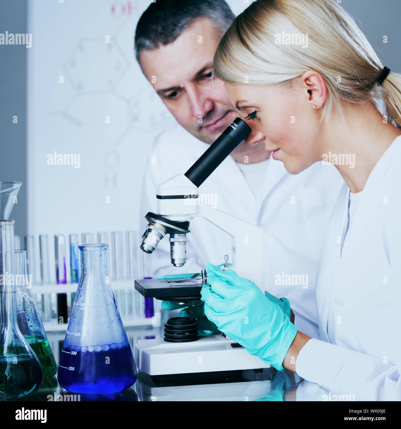 two scientist in chemical lab conducting experiments Stock Photo - Alamy