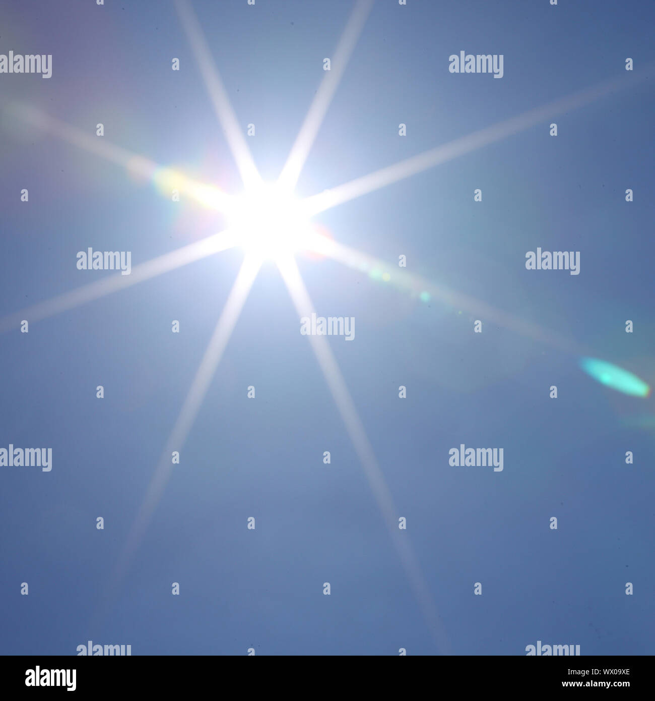 sun in blue day sky Stock Photo - Alamy