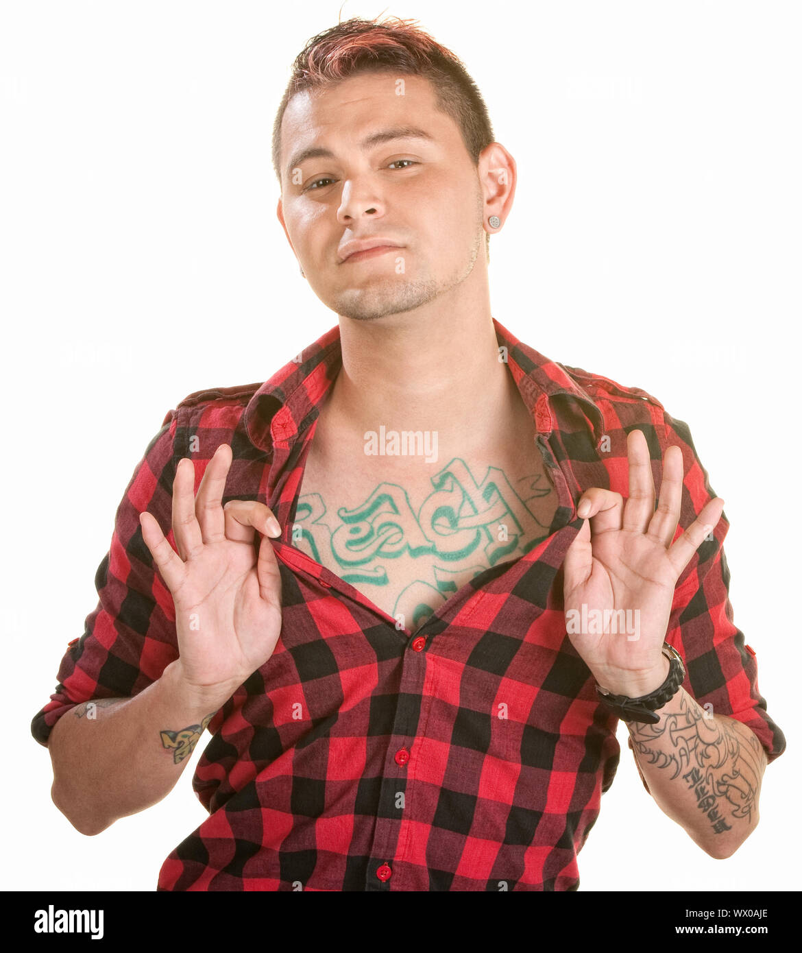 Cute young man over white showing off chest tattoo Stock Photo - Alamy