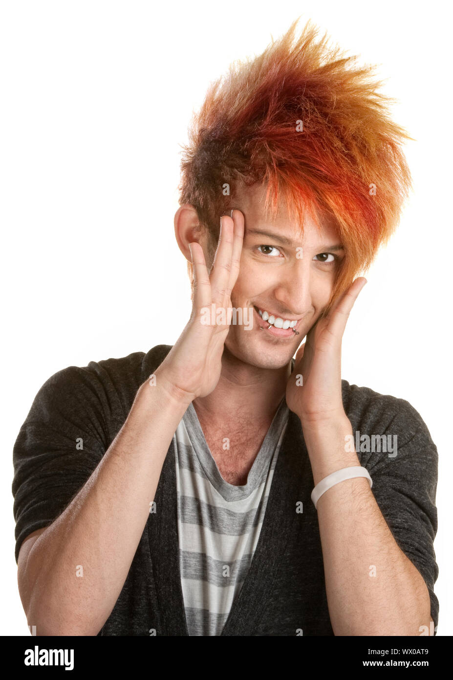 Caucasian teenage male with hands on side of face Stock Photo - Alamy