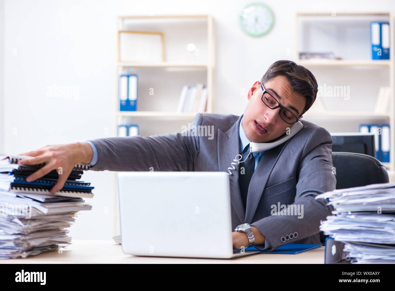 Desperate sad employee tired at his desk in call center Stock Photo - Alamy