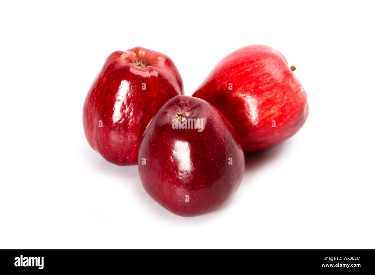 three red apples isolated on white background Stock Photo - Alamy