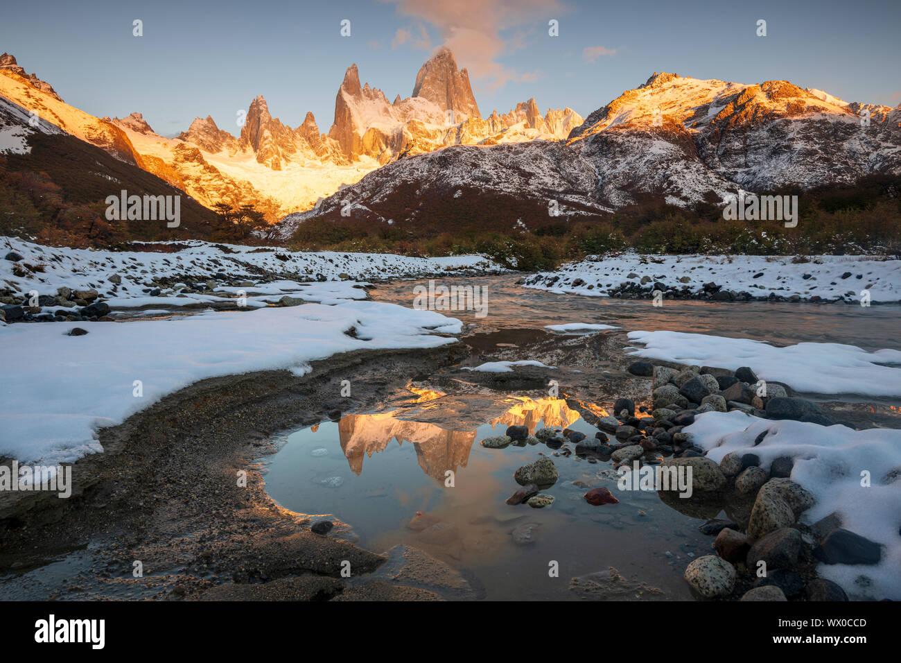 Reflections of Mount Fitz Roy and Cerro Torre in autumn with covering ...