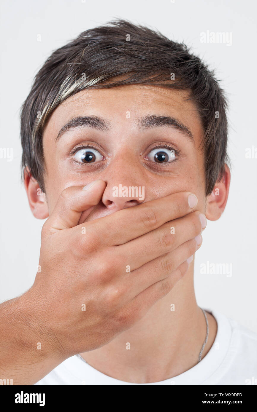 afraid swarthy victim man with hand covering his mouth Stock Photo - Alamy