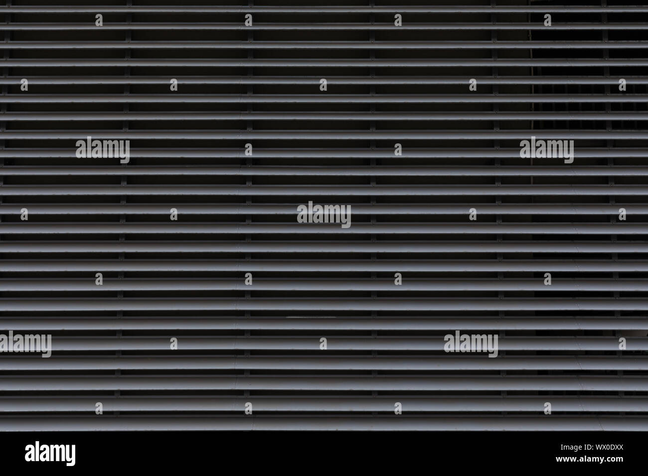 Gray galvanized thin layers of metal panels, horizontal pattern on gate ...
