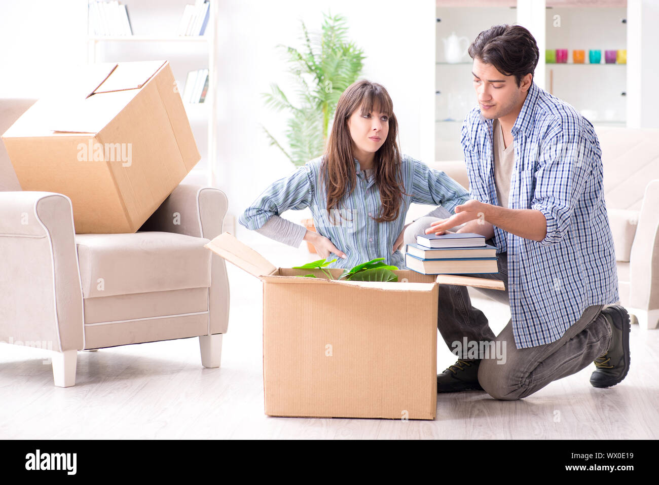 Young family moving in to new apartment after paying off mortgag Stock ...