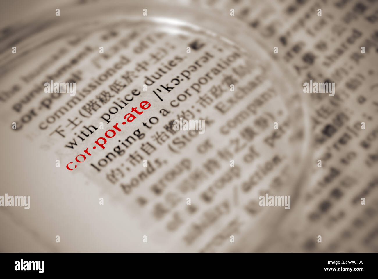 Corporate definition in dictionary with magnifier in yellow color Stock ...