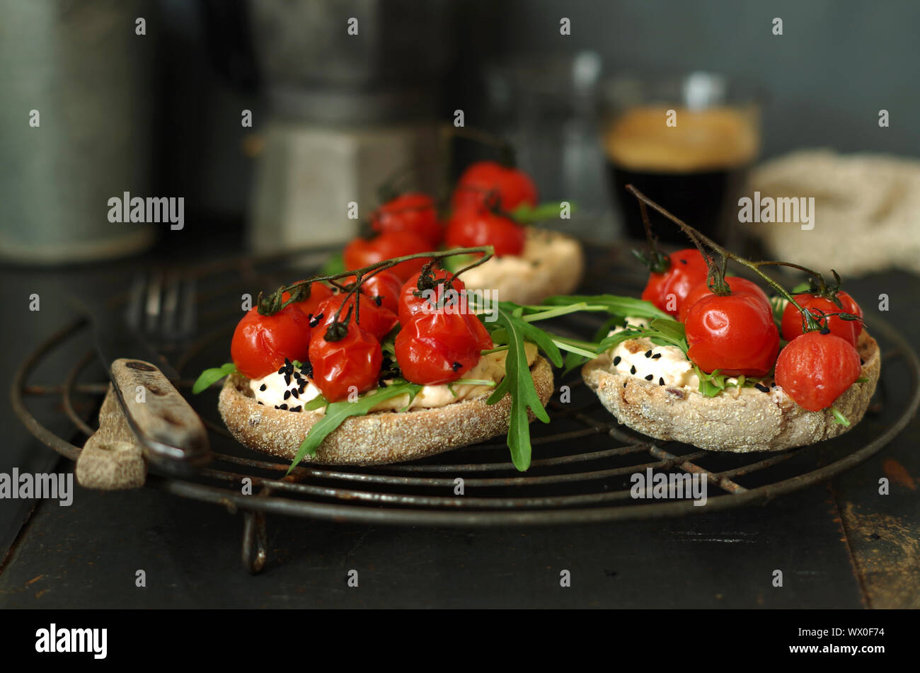 toast roll with cream cheese, rocket and tomatos Stock Photo - Alamy
