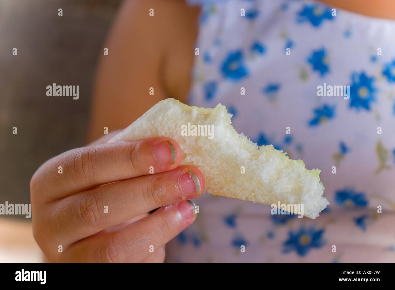 Children eating food with dirty hand and dirt lodged in the nails ...