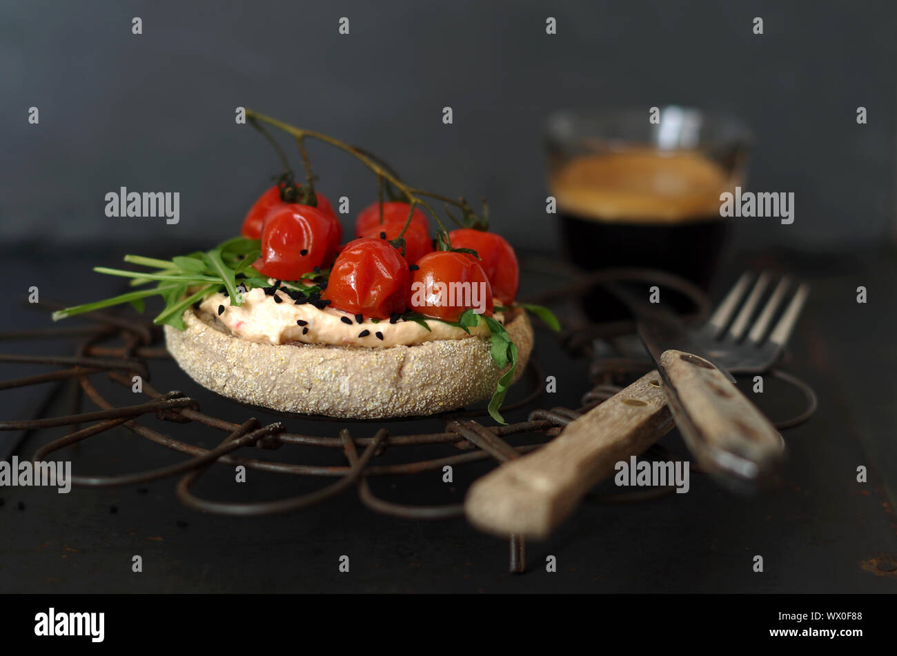 toast roll with cream cheese, rocket and tomatos Stock Photo - Alamy