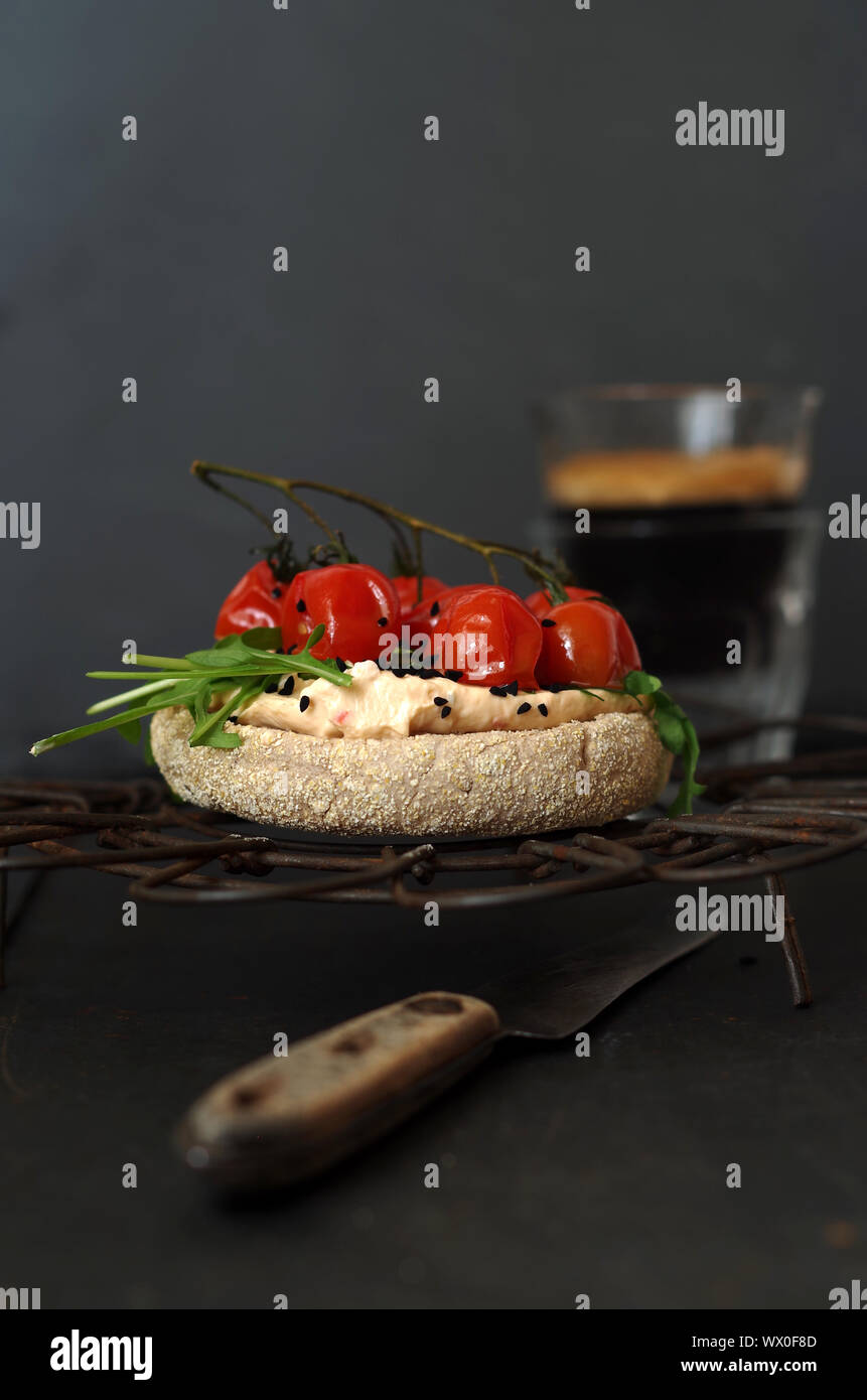 toast roll with cream cheese, rocket and tomatos Stock Photo - Alamy