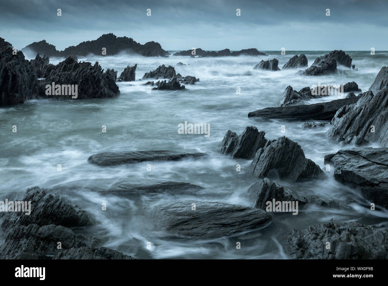 Rocky cove on the dramatic North Devon coast in winter, Devon, England ...