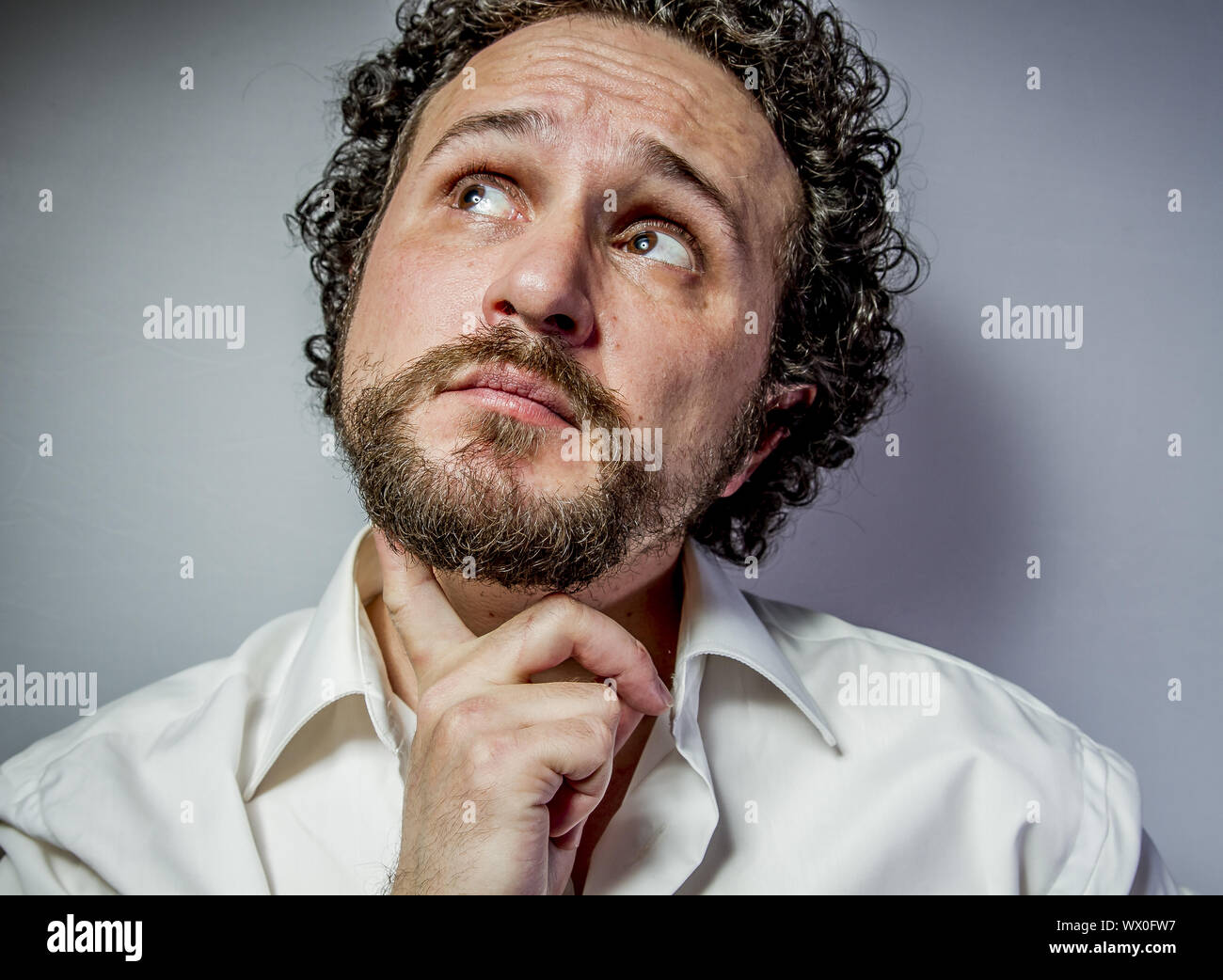 concern for the future, man with intense expression, white shirt Stock ...