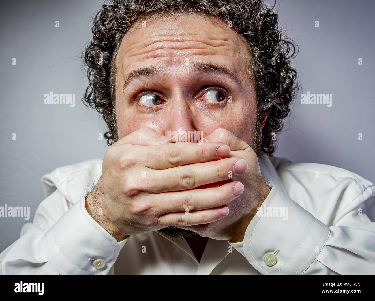 say nothing, silence, man with intense expression, white shirt Stock ...