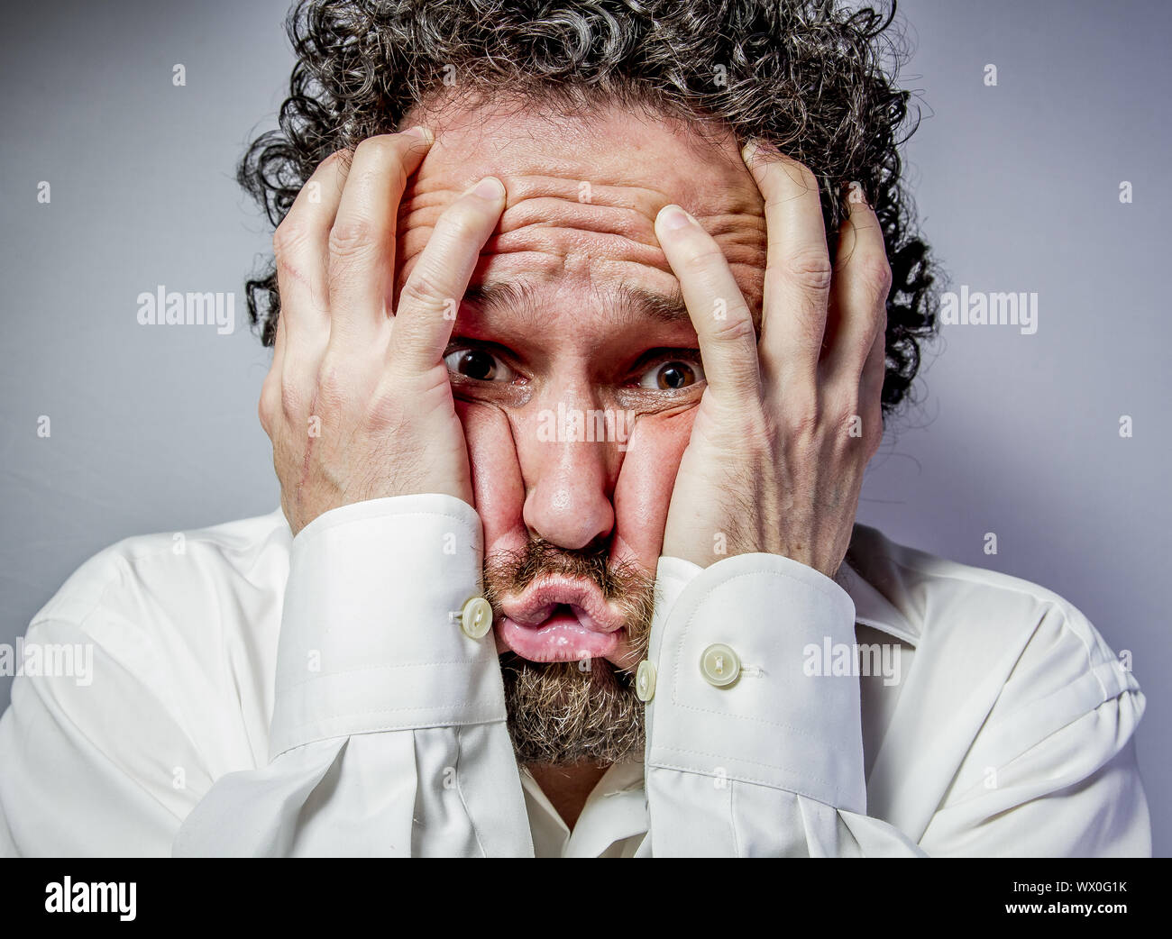concern for the future, man with intense expression, white shirt Stock ...