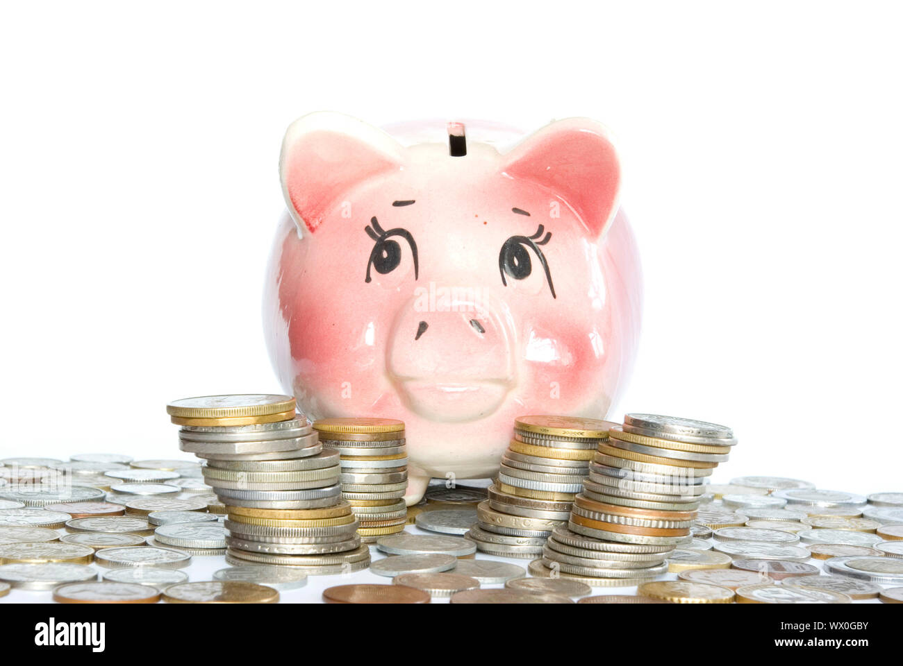 Pink piggy bank isolated on white background with coins Stock Photo - Alamy