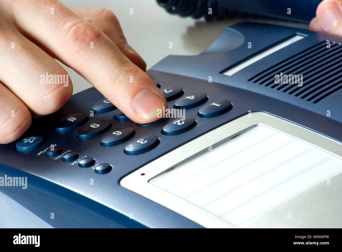 finger with blue telephone keypad Stock Photo - Alamy
