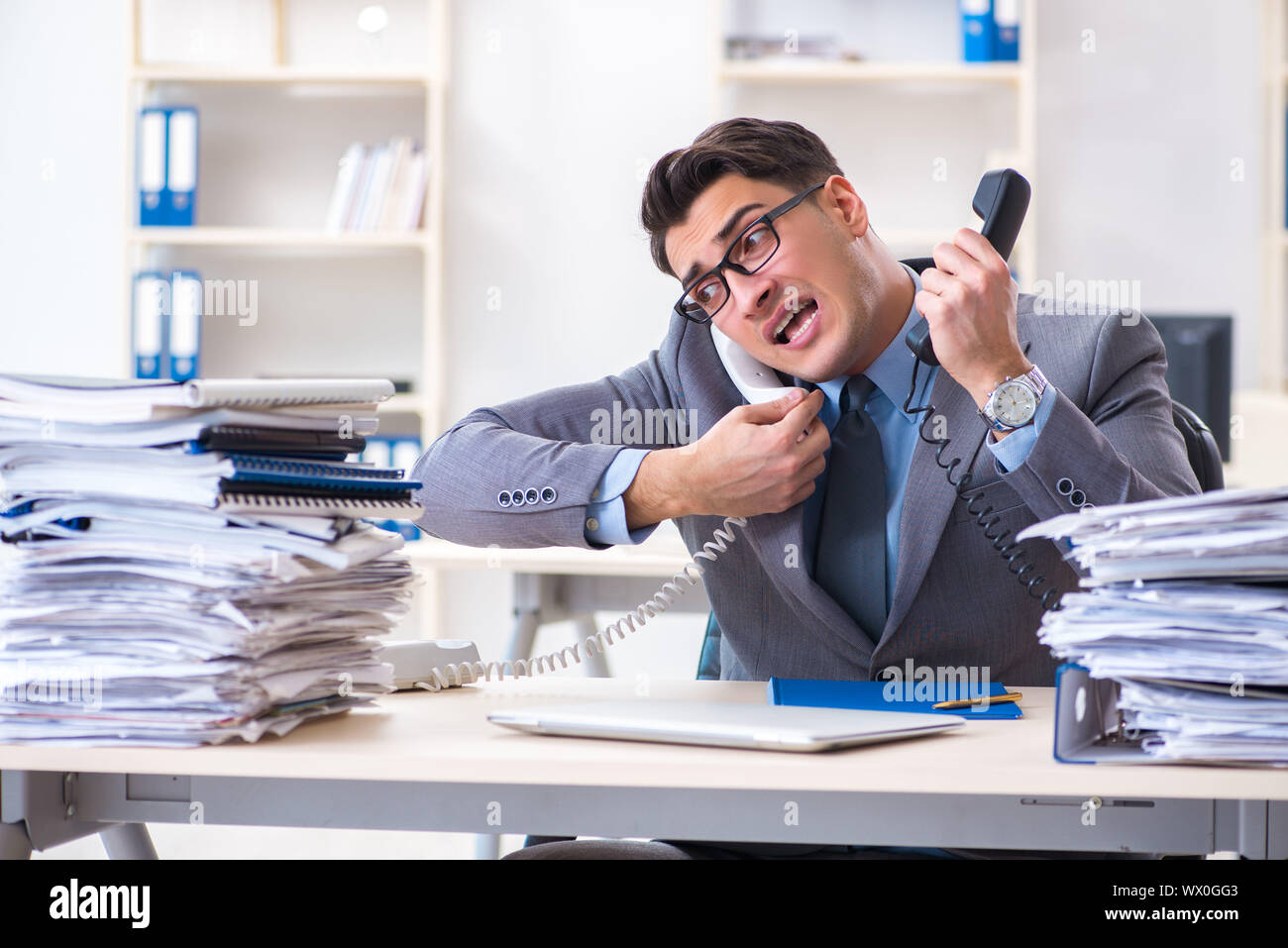 Desperate sad employee tired at his desk in call center Stock Photo - Alamy