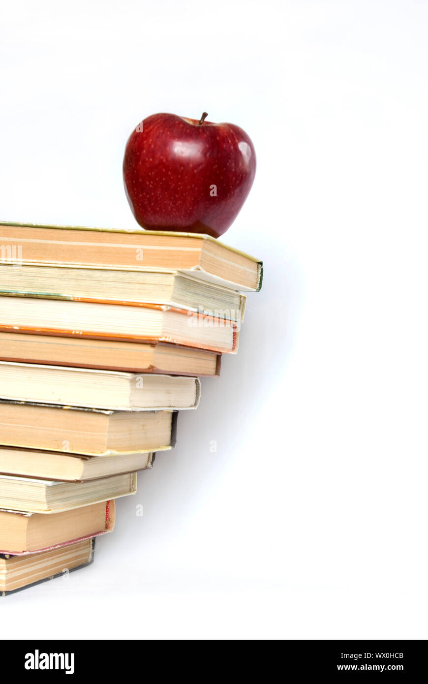 Red apple and stack of books for school Stock Photo - Alamy
