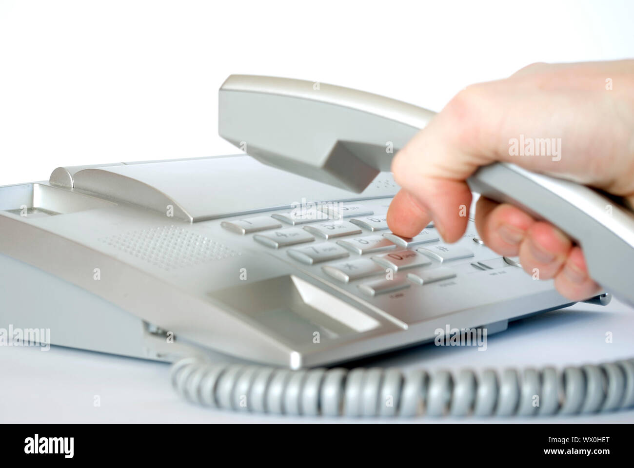 Finger presses figure on phone Stock Photo - Alamy