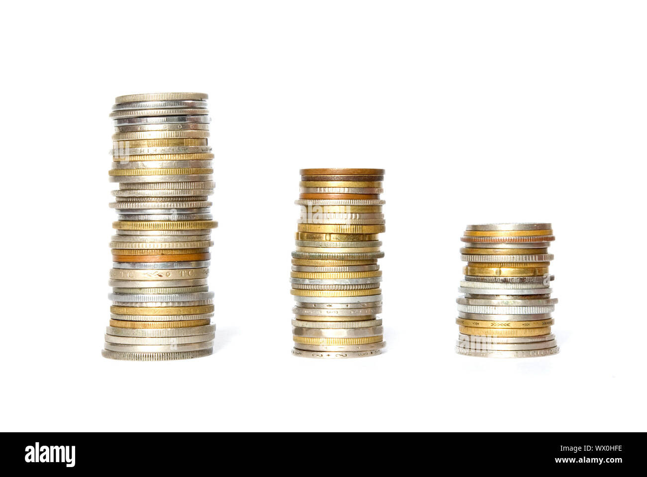 towers of coins isolated on a whiteness Stock Photo - Alamy