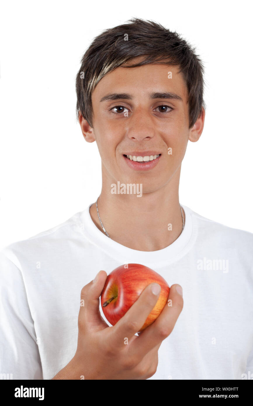 young swarthy man with brown eyes and a red apple in his hand on white ...