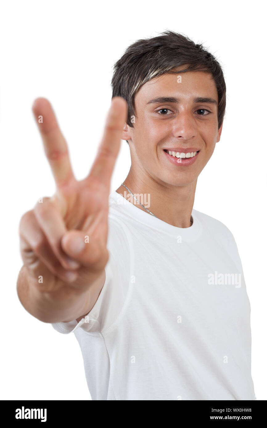 young swarthy man with brown eyes shows peace / victory symbol on white ...