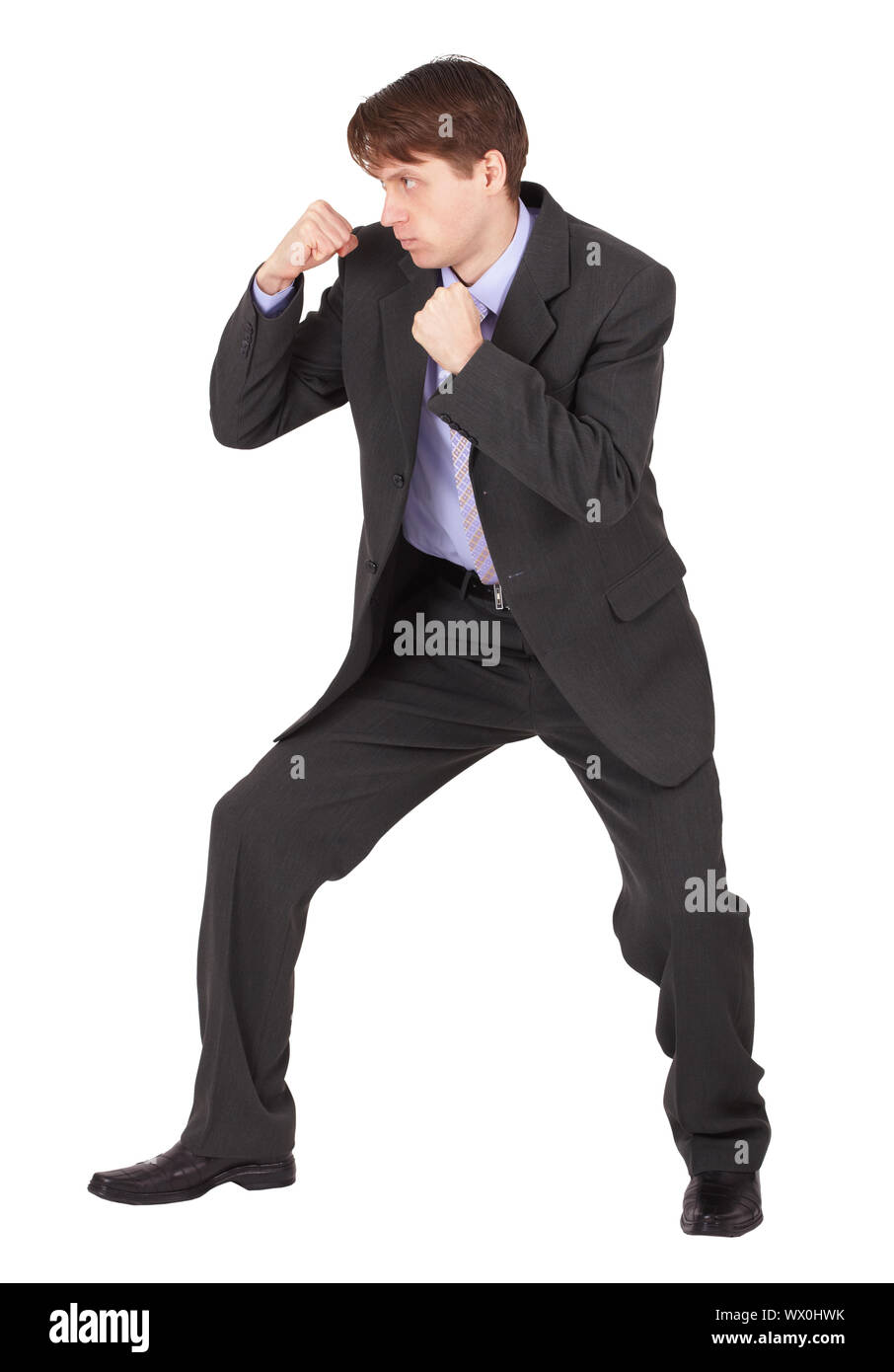 Businessman in boxing fighting stance against a white background Stock ...