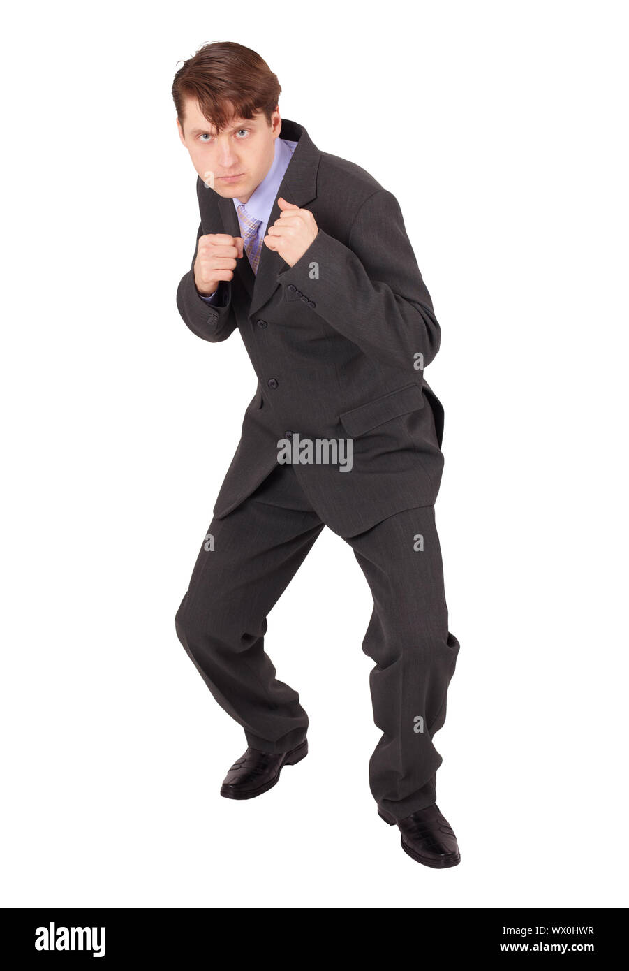 Young man in boxing fighting stance against a white background Stock ...