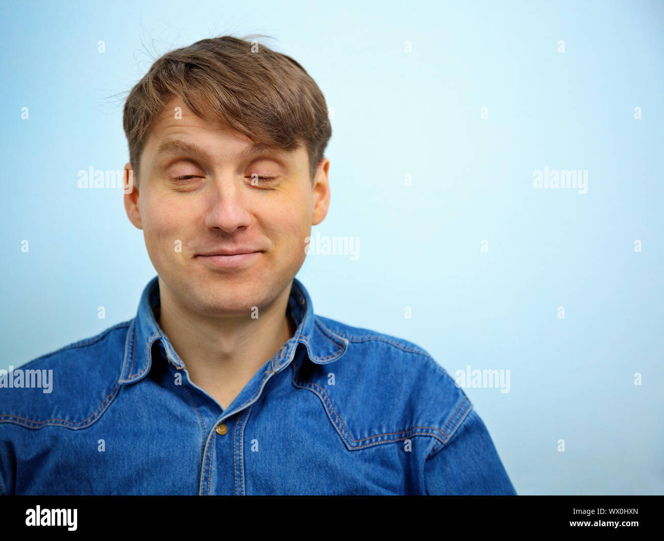 Dreaming a man with a satisfied look on his face Stock Photo - Alamy