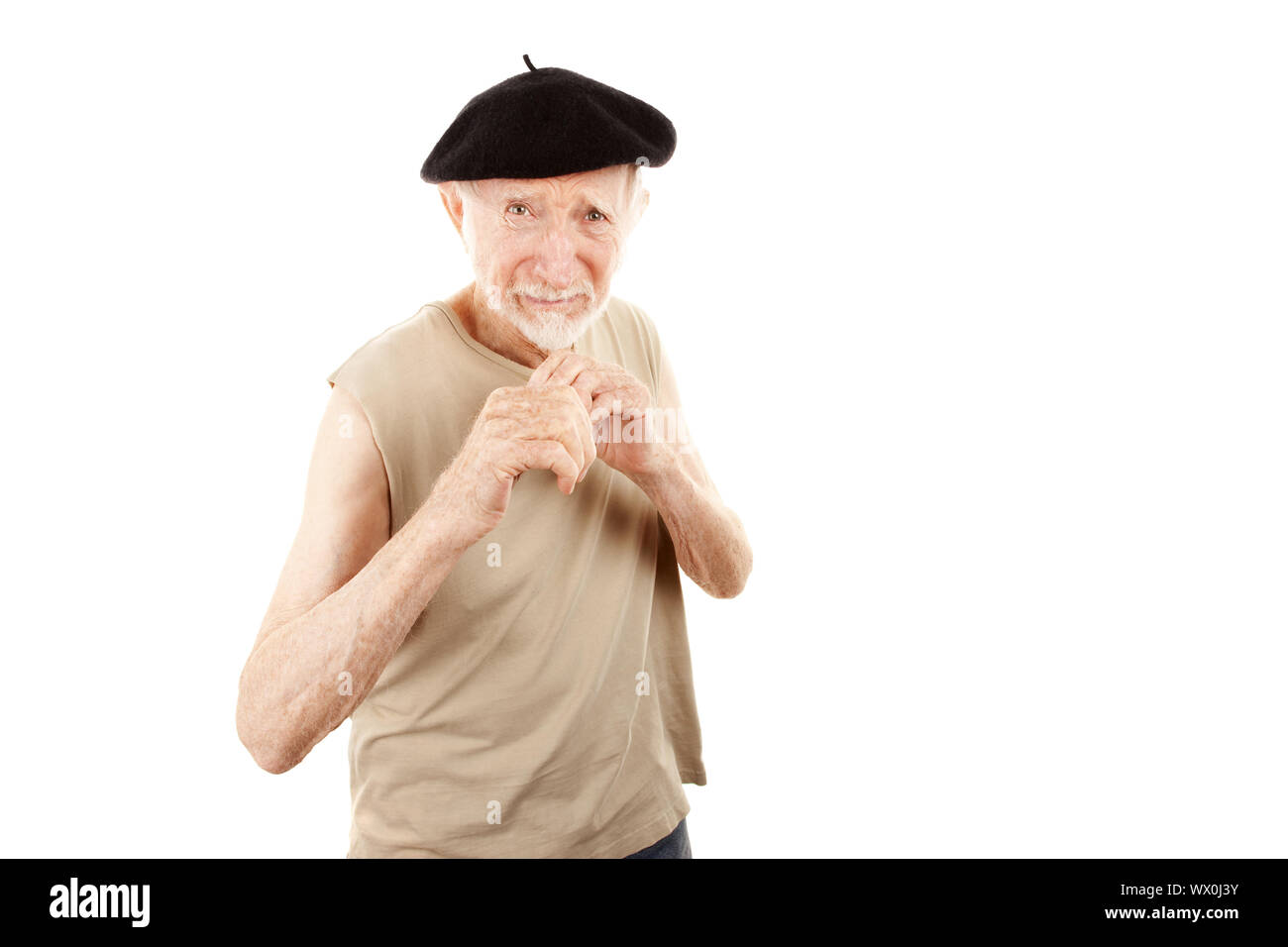 Senior man wearing beret in fighting stance Stock Photo - Alamy