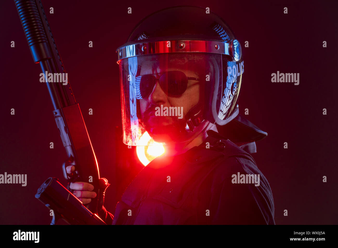 policeman with full equipment for anti-riot, Law enforcer in protective ...