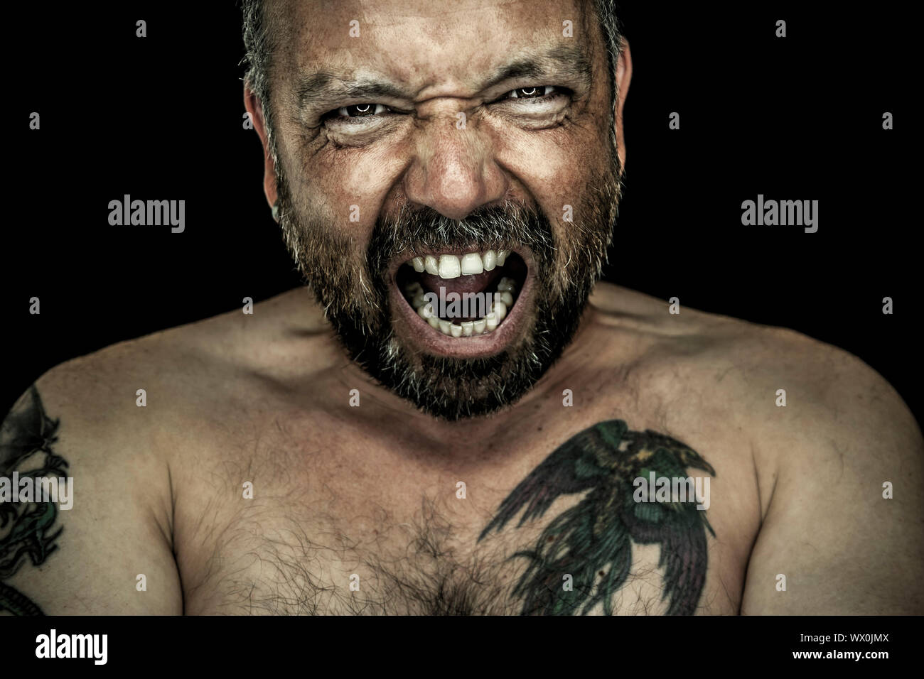 An image of an angry man with a beard Stock Photo - Alamy