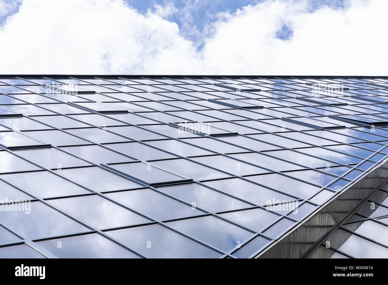 Ground view of cutting-edge building facade design Stock Photo - Alamy