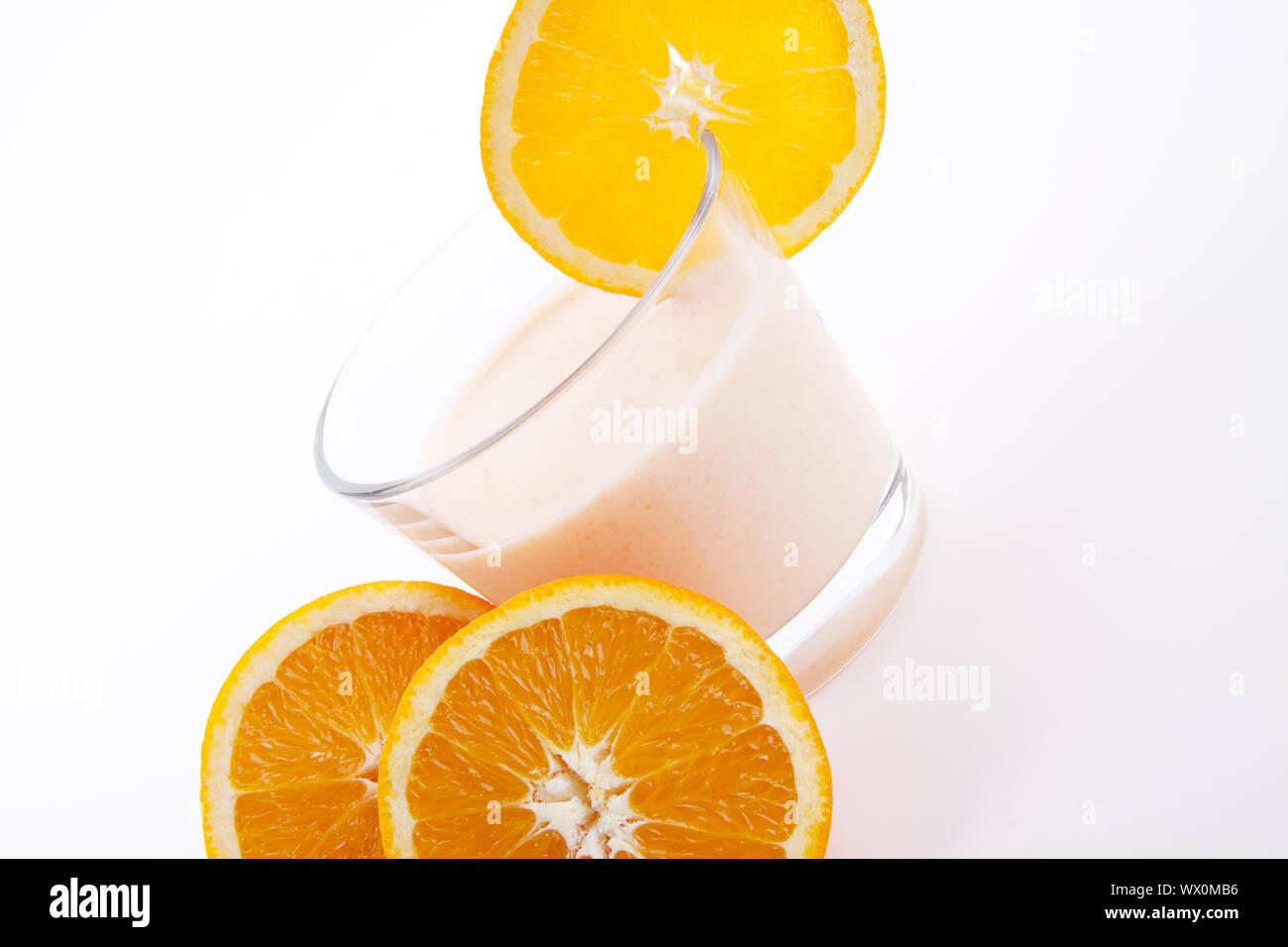 fresh tasty orange yoghurt shake dessert isolated Stock Photo - Alamy