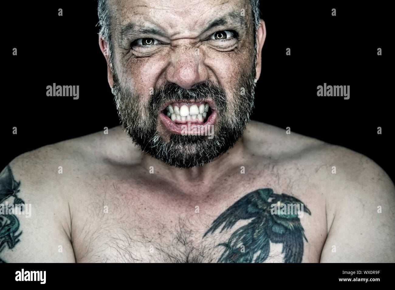 An image of an angry man with a beard Stock Photo - Alamy
