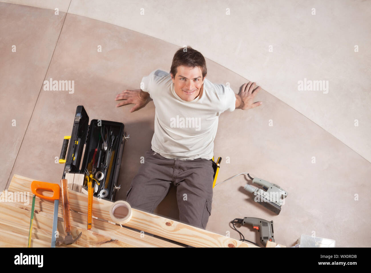 Top view of a happy handsome man with carpentry tools around Stock ...
