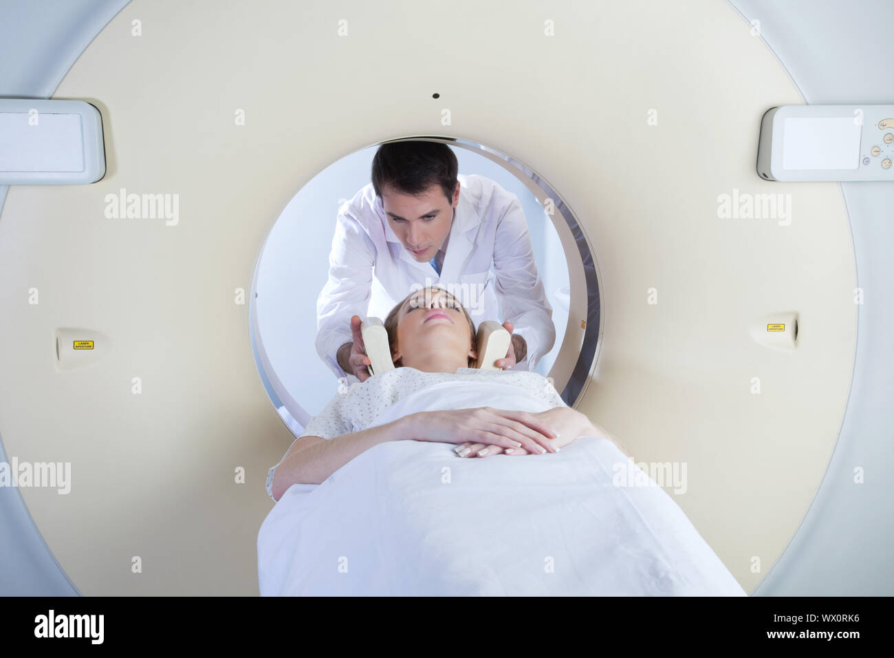 woman in a ct scan with medical professional Stock Photo - Alamy