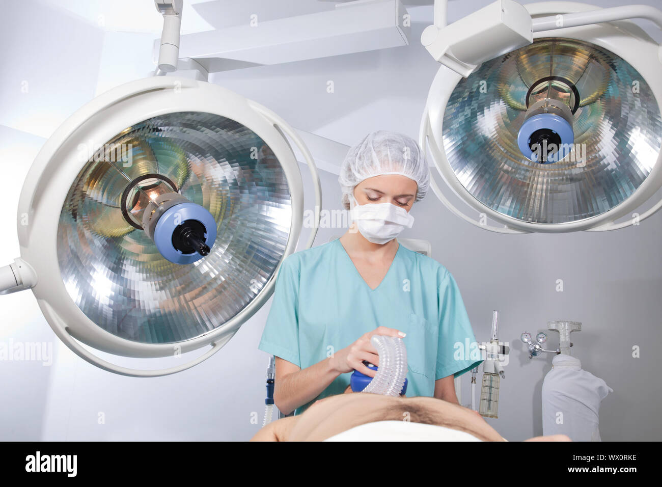 Anesthetist watching over patient before surgery Stock Photo - Alamy